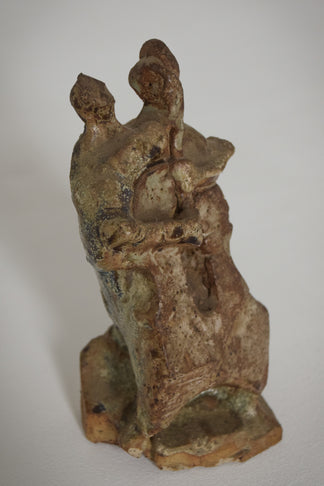 Sculpture of a Figure Playing an Instrument in an Abstract Style ...